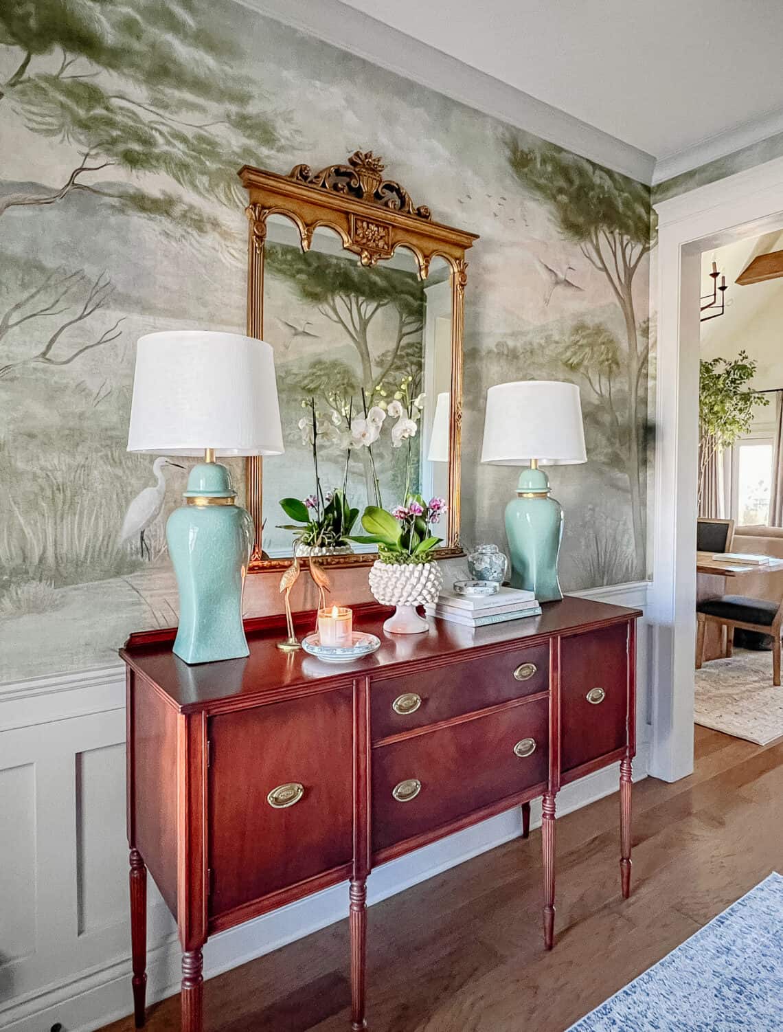 Pastoral Landscape Mural Envelops the Foyer - Deeply Southern Home